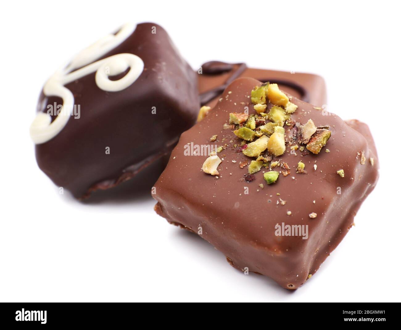 Delicious chocolate candy isolated on white Stock Photo - Alamy