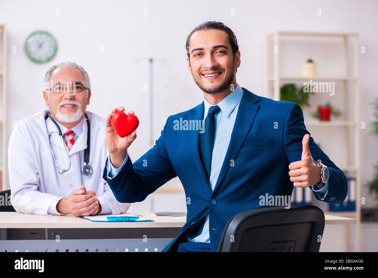 Doctor and businessman discussing medical project Stock Photo - Alamy