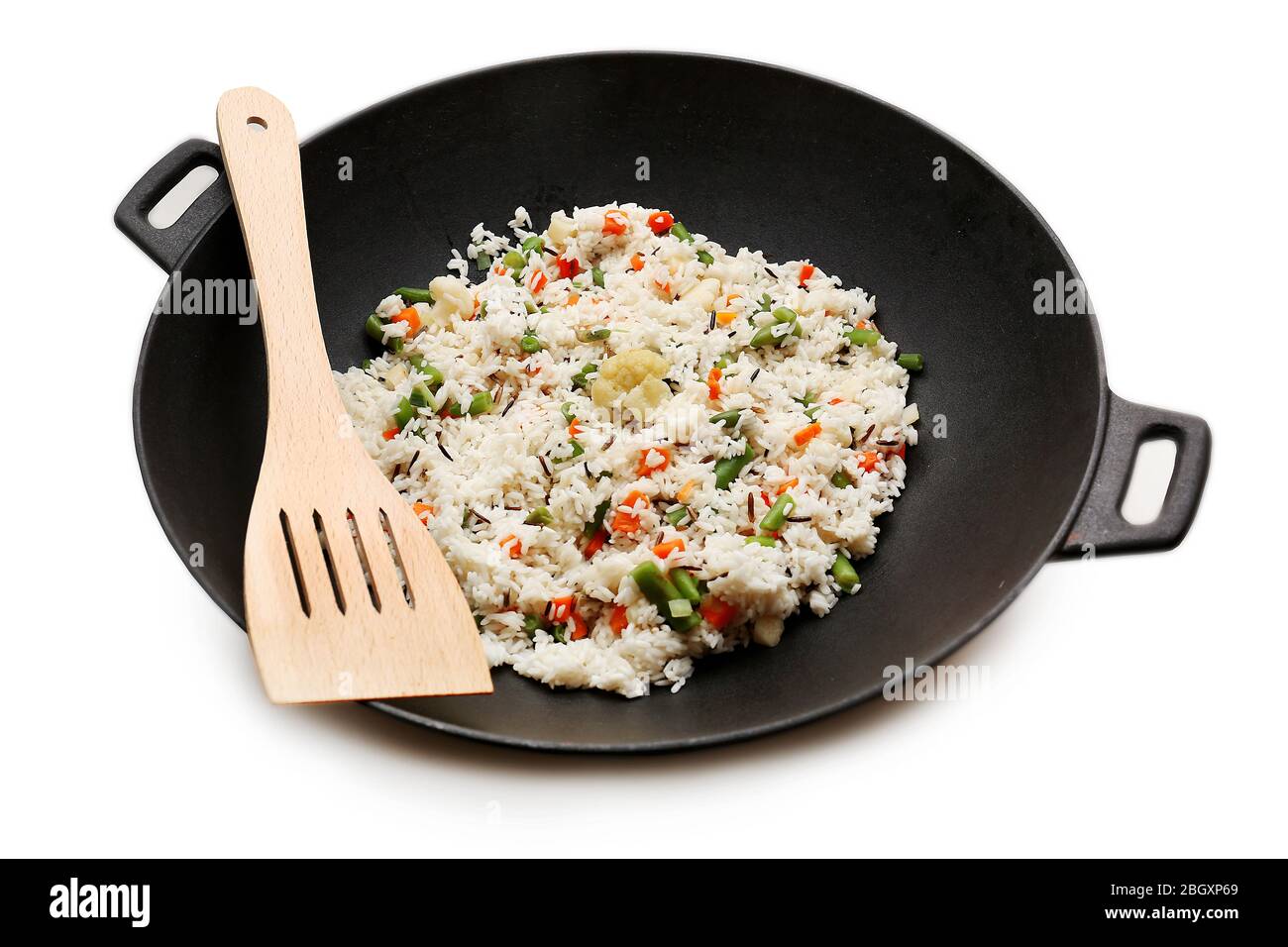 Tasty rice preparing in wok, isolated on white Stock Photo - Alamy