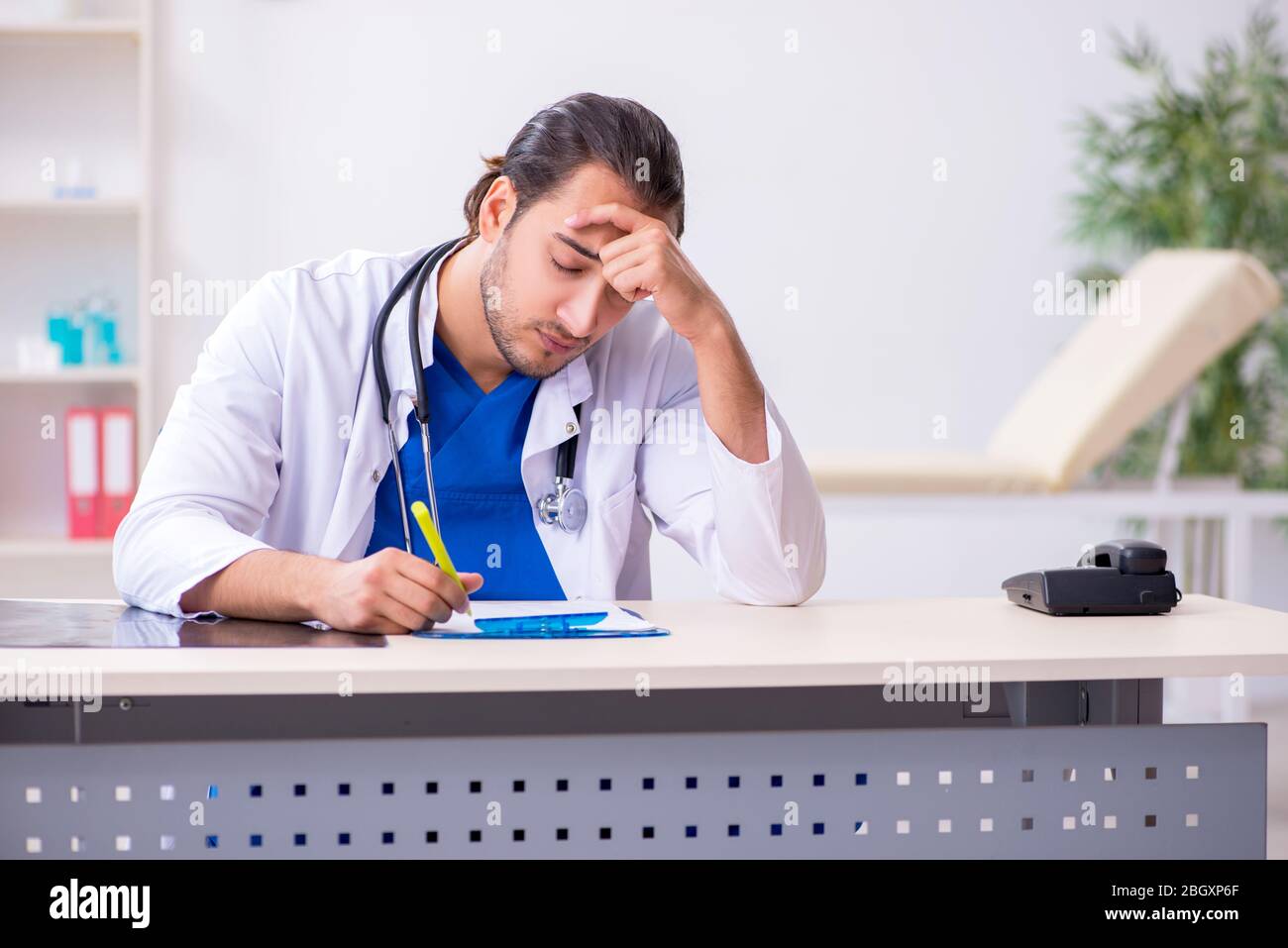 Young doctor being tired after night shift hi-res stock photography and ...