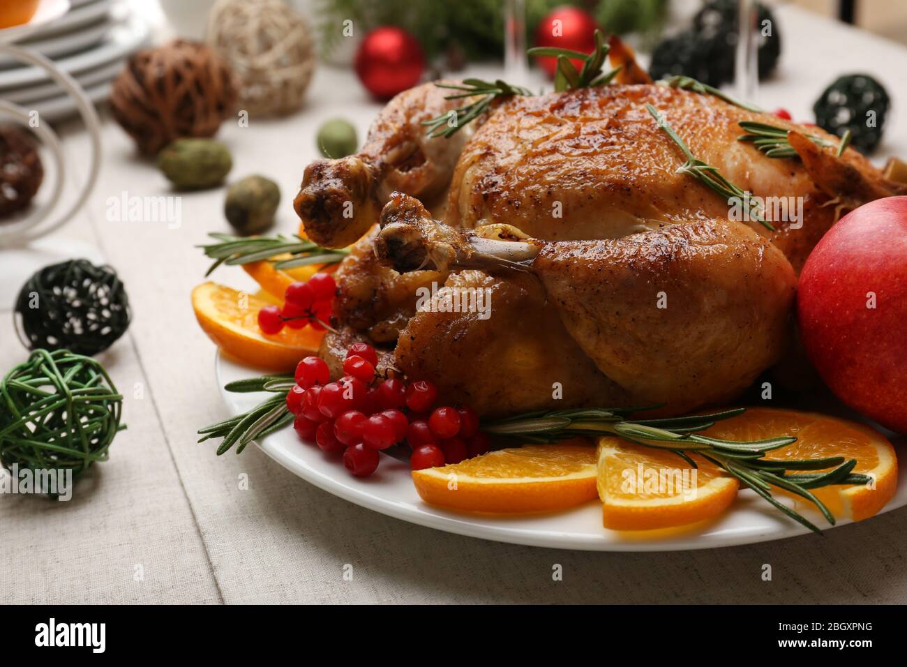Baked chicken for festive dinner. Christmas table setting Stock Photo ...