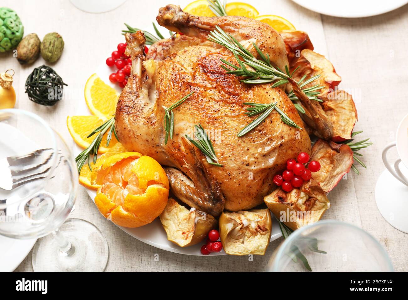 Baked chicken for festive dinner. Christmas table setting Stock Photo ...
