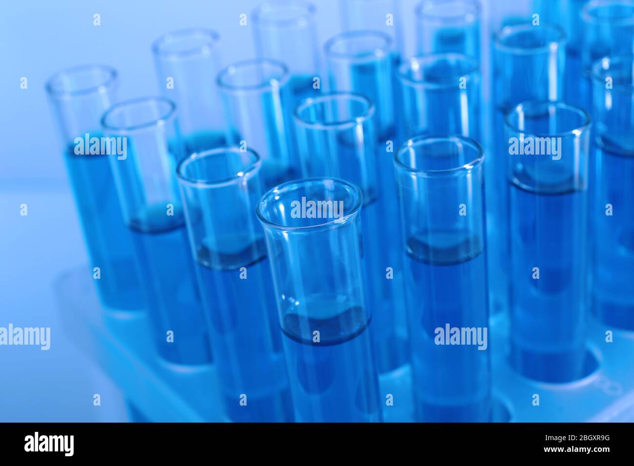 Blue water in a transparent test-tube on light background Stock Photo ...