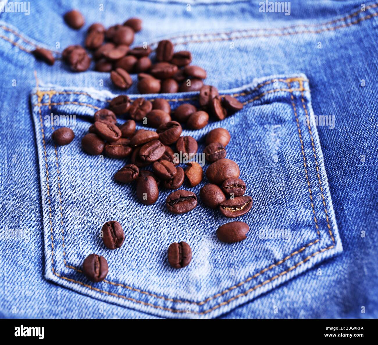 Coffee beans on the jeans background Stock Photo - Alamy