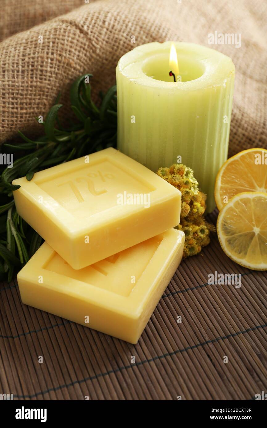 Handmade soap with the branches of rosemary on sackcloth, flowers and ...