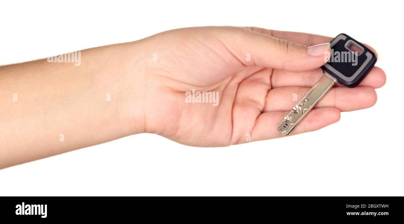 Key in hand isolated on white Stock Photo - Alamy
