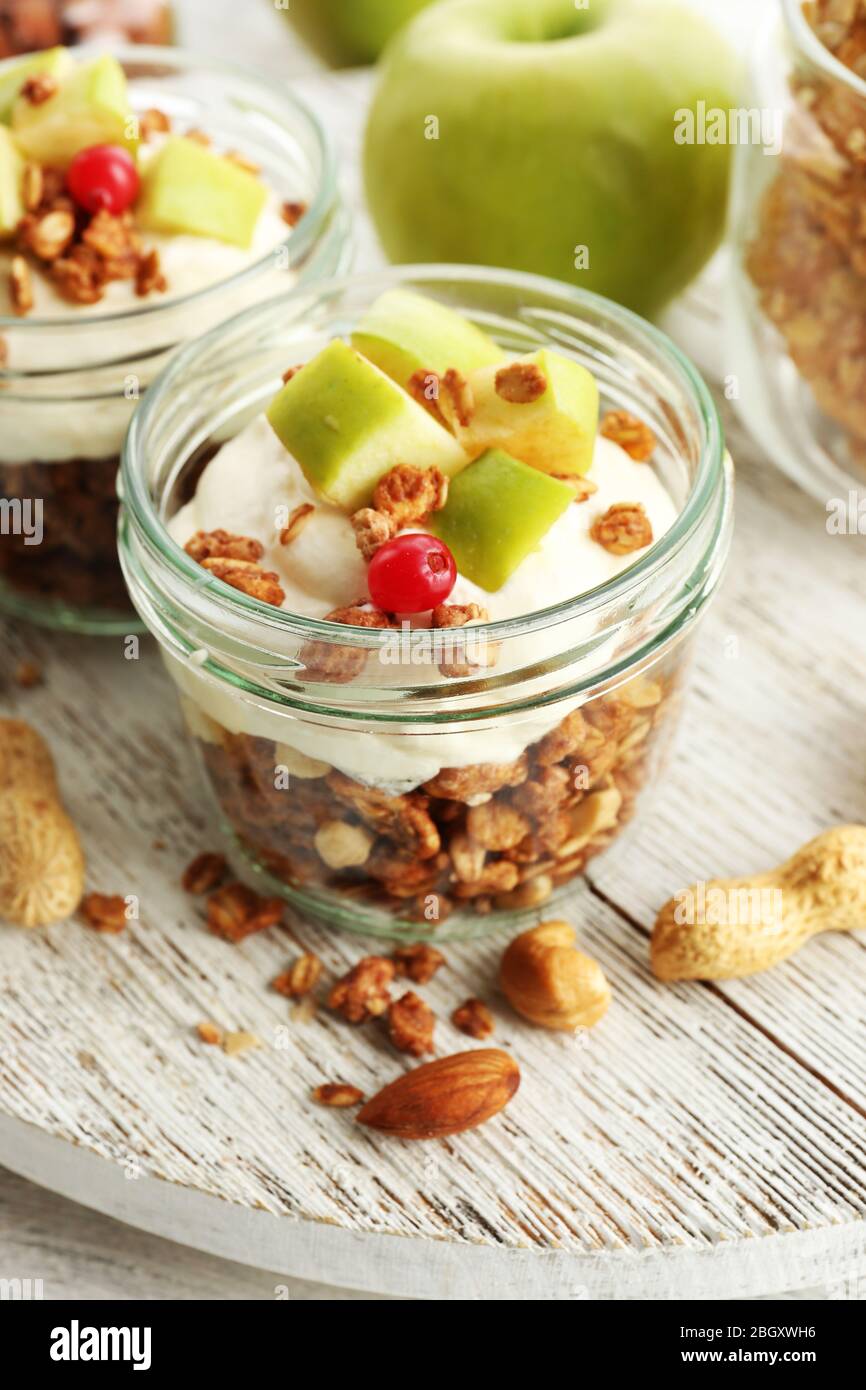 Healthy layered dessert with muesli and fruits on table Stock Photo - Alamy