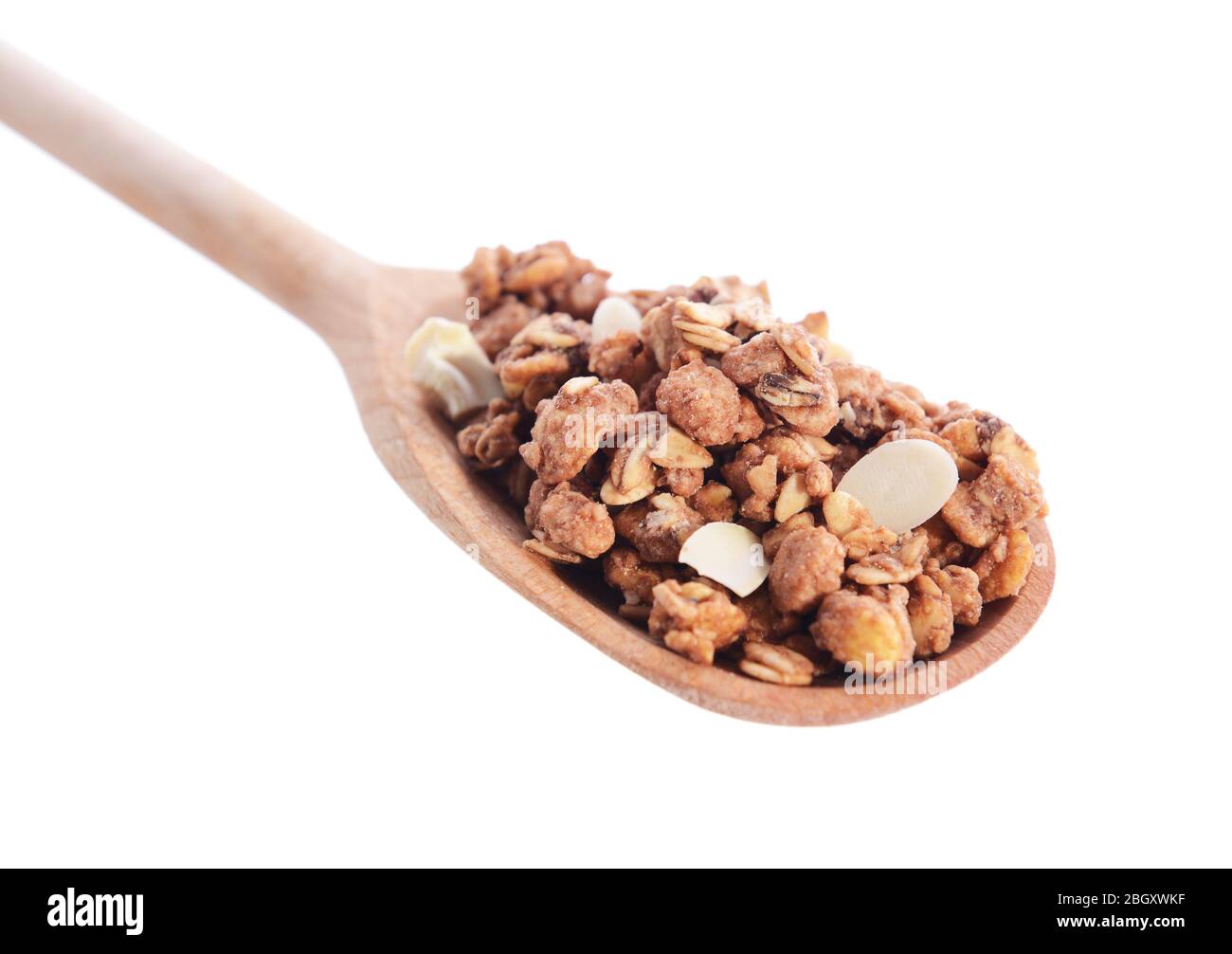 Granola in spoon isolated on white Stock Photo - Alamy