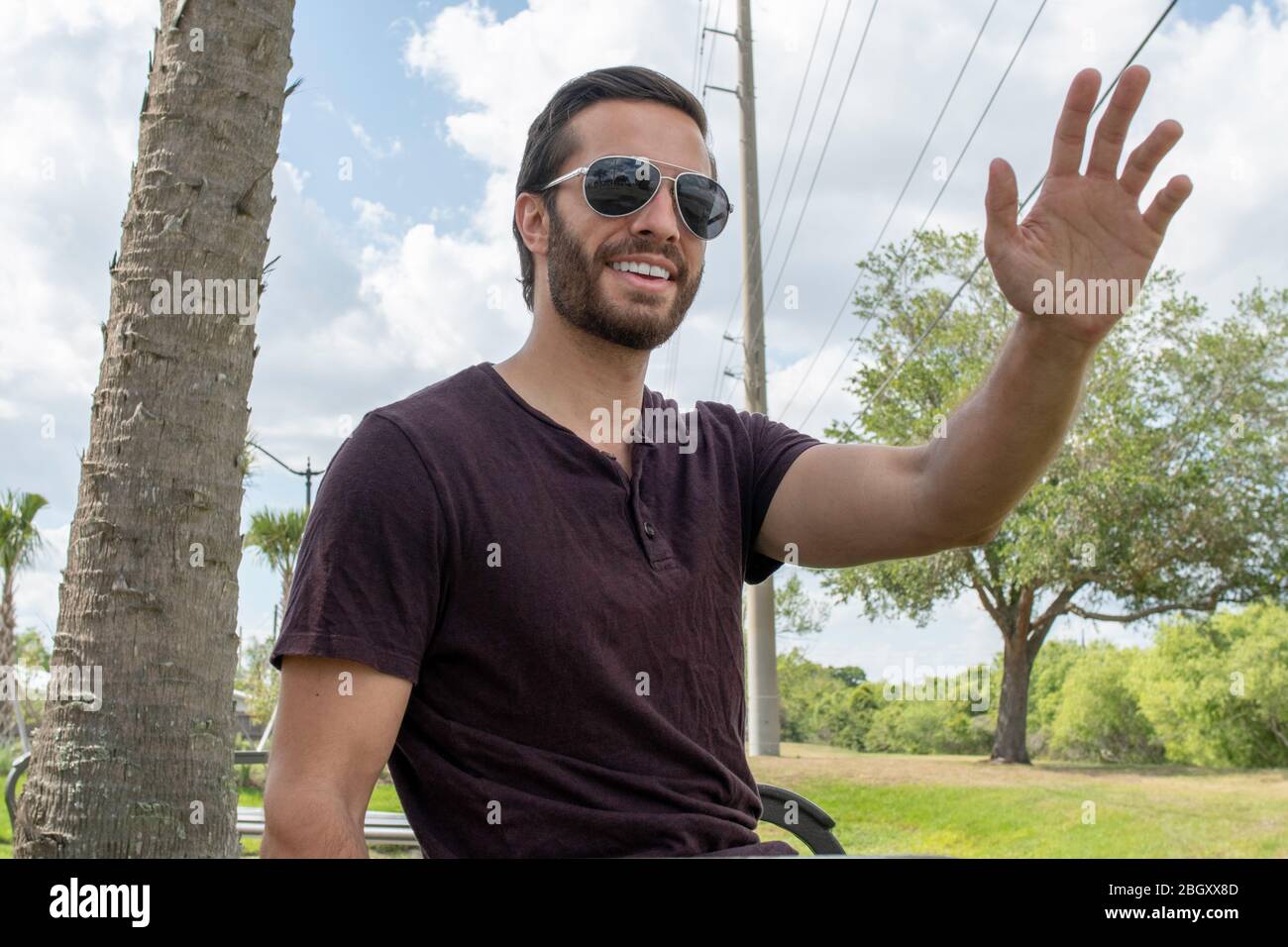 Casual man reaching out hand hi-res stock photography and images - Alamy