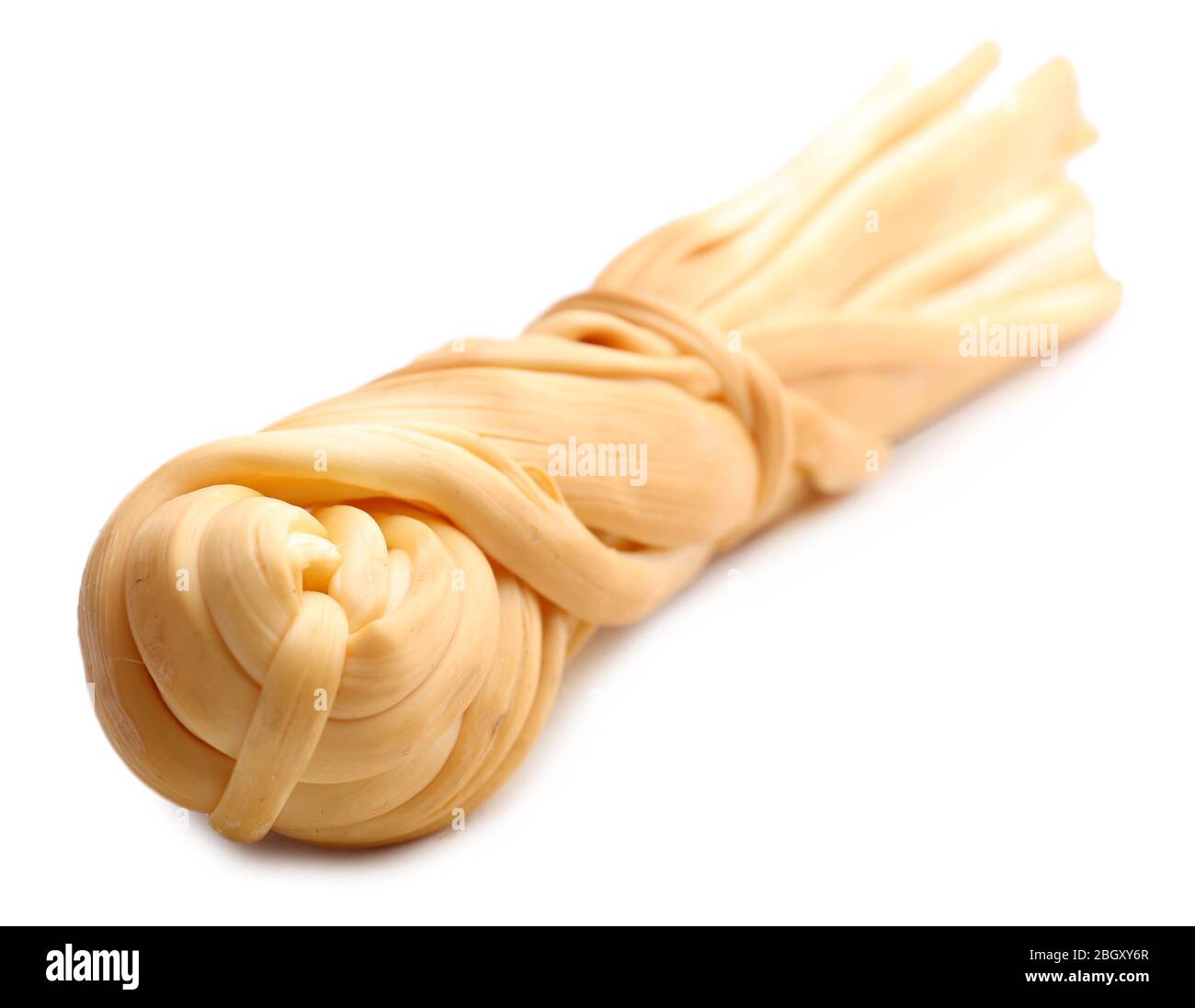Smoked braided cheese isolated on white Stock Photo - Alamy