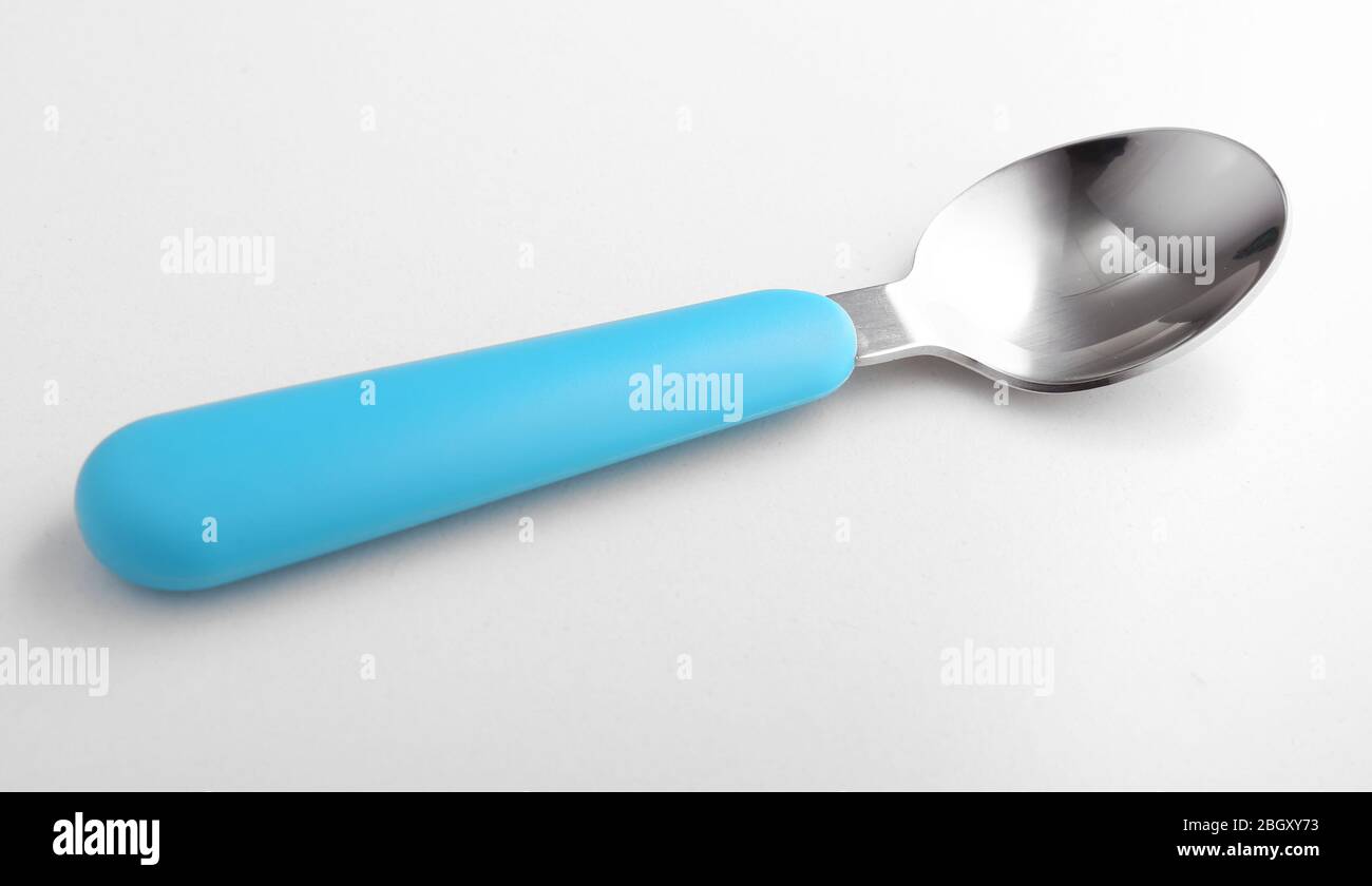 Blue baby spoon isolated on white Stock Photo - Alamy