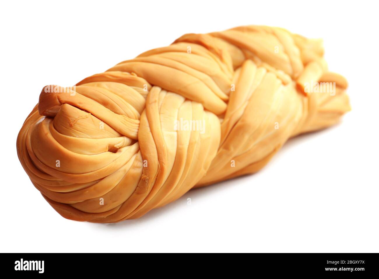 Smoked braided cheese isolated on white Stock Photo - Alamy
