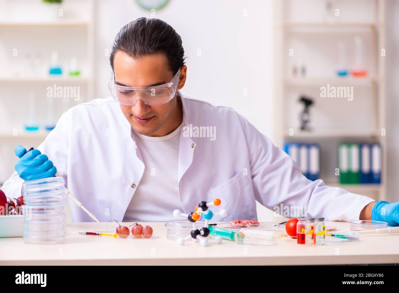 Young nutrition expert testing food products in lab Stock Photo - Alamy