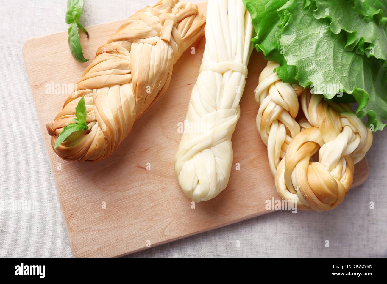 Smoked braided cheese close-up Stock Photo - Alamy
