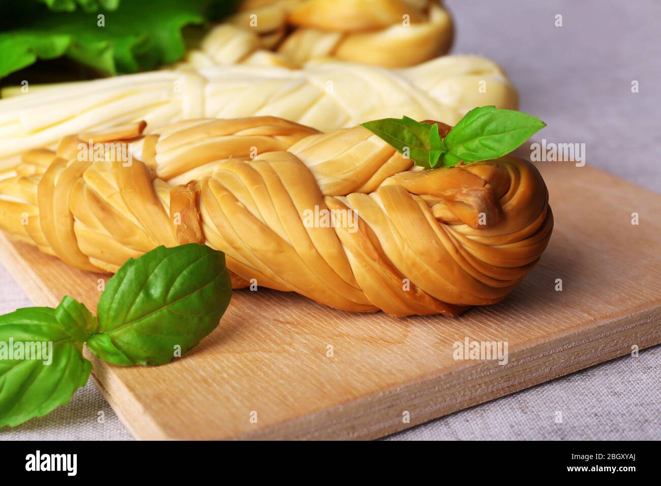 Smoked braided cheese close-up Stock Photo - Alamy