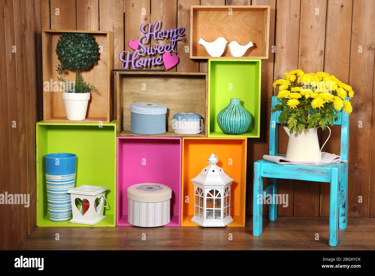 Beautiful colorful shelves with different home related objects on ...