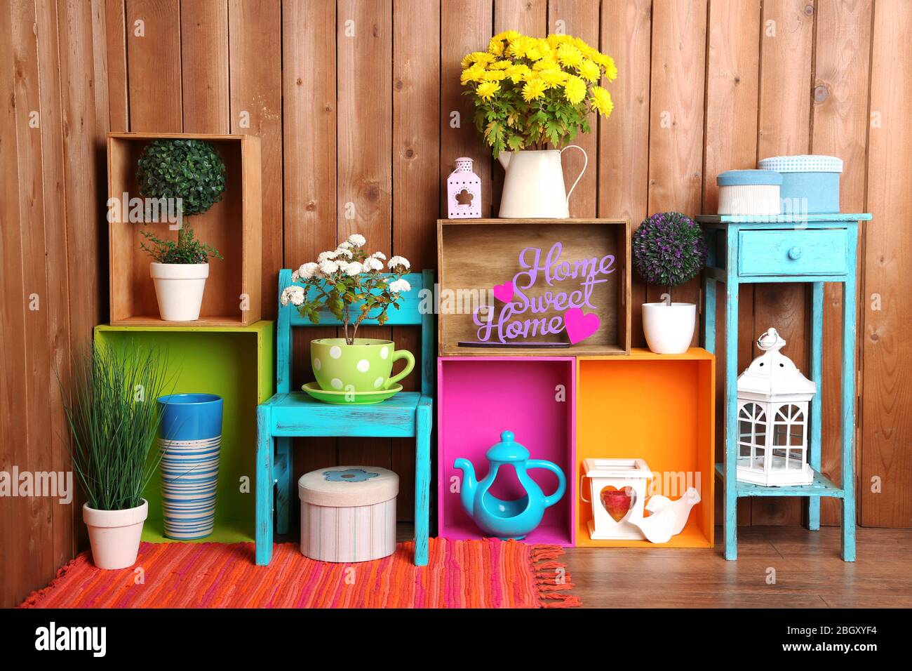 Beautiful colorful shelves with different home related objects on ...