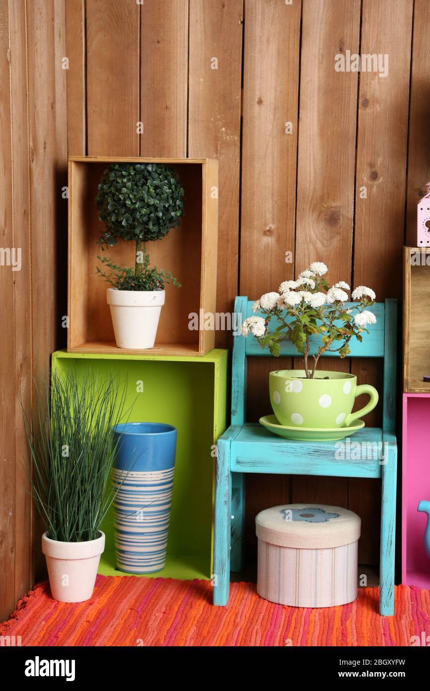 Beautiful colorful shelves with different home related objects on ...