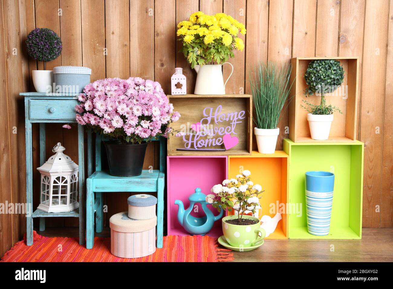 Beautiful colorful shelves with different home related objects on ...