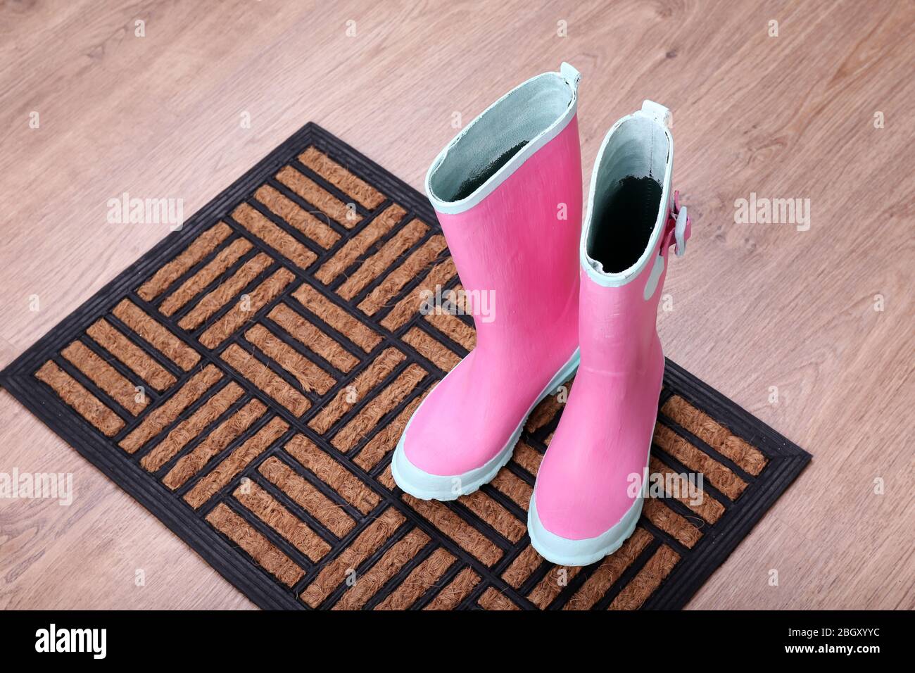 Boots on the door mat hi-res stock photography and images - Alamy