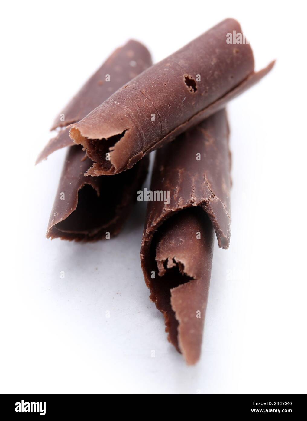 Chocolate curls isolated on white Stock Photo - Alamy