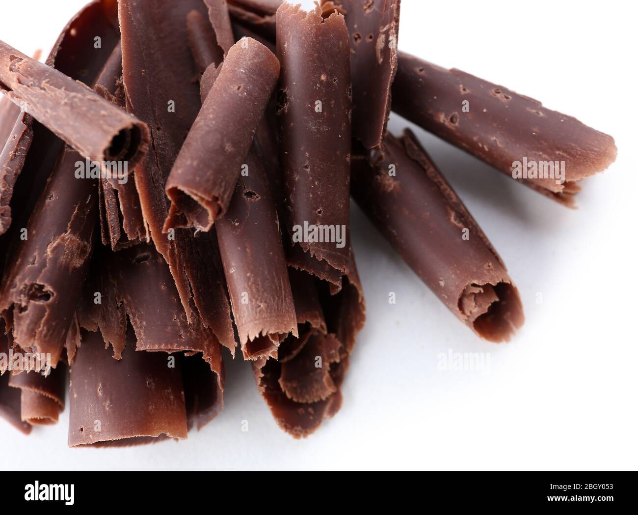 Chocolate curls isolated on white Stock Photo - Alamy