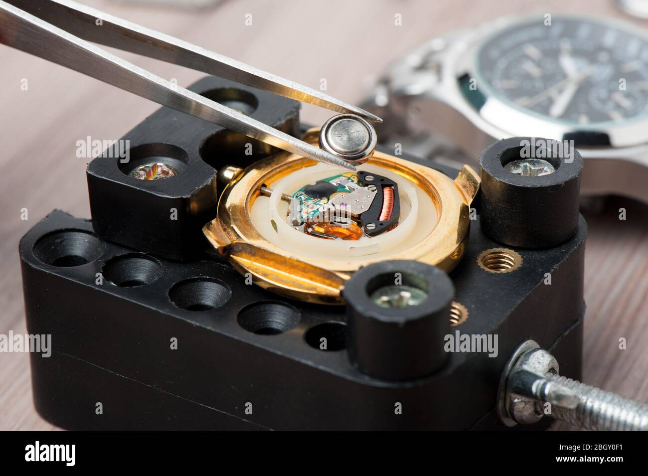 watch battery replacement, watchmaker replacing watch battery on quartz ...
