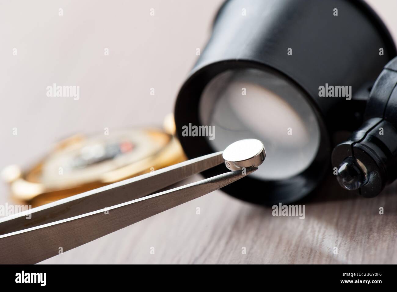 watch battery replacement, watchmaker replacing watch battery on quartz ...