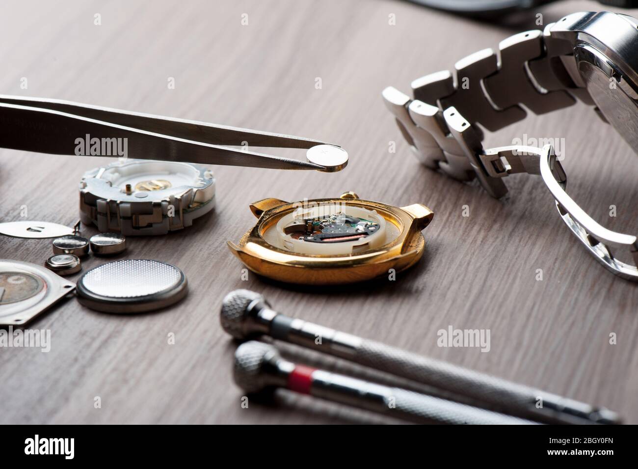 watch battery replacement, watchmaker replacing watch battery on quartz ...