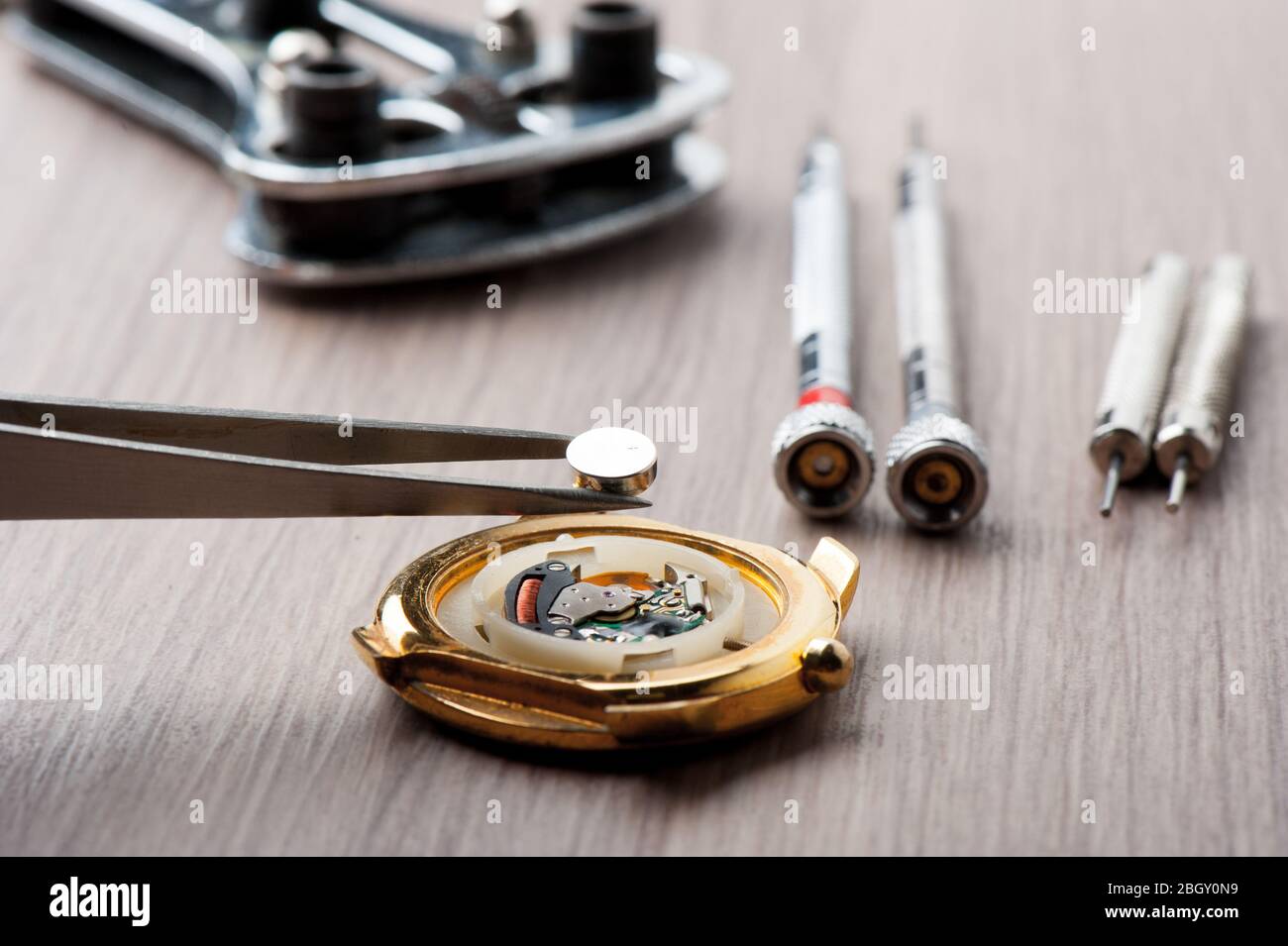 watch battery replacement, watchmaker replacing watch battery on quartz ...