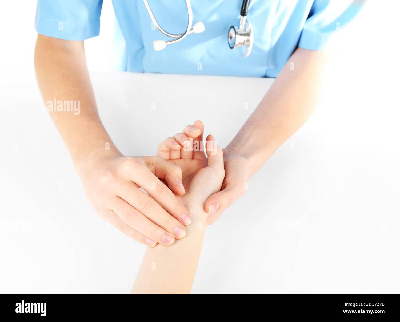 Checking pulse by hand on white background Stock Photo - Alamy