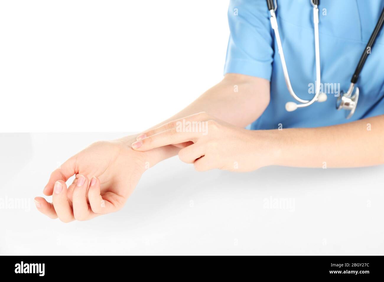 Taking heart rate oneself by hand, on white background Stock Photo - Alamy