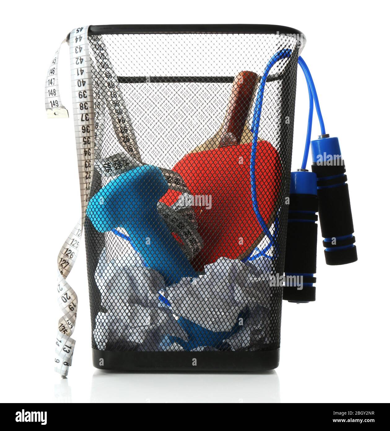 Metal trash bin with sport equipment, crumpled paper and weight scale ...