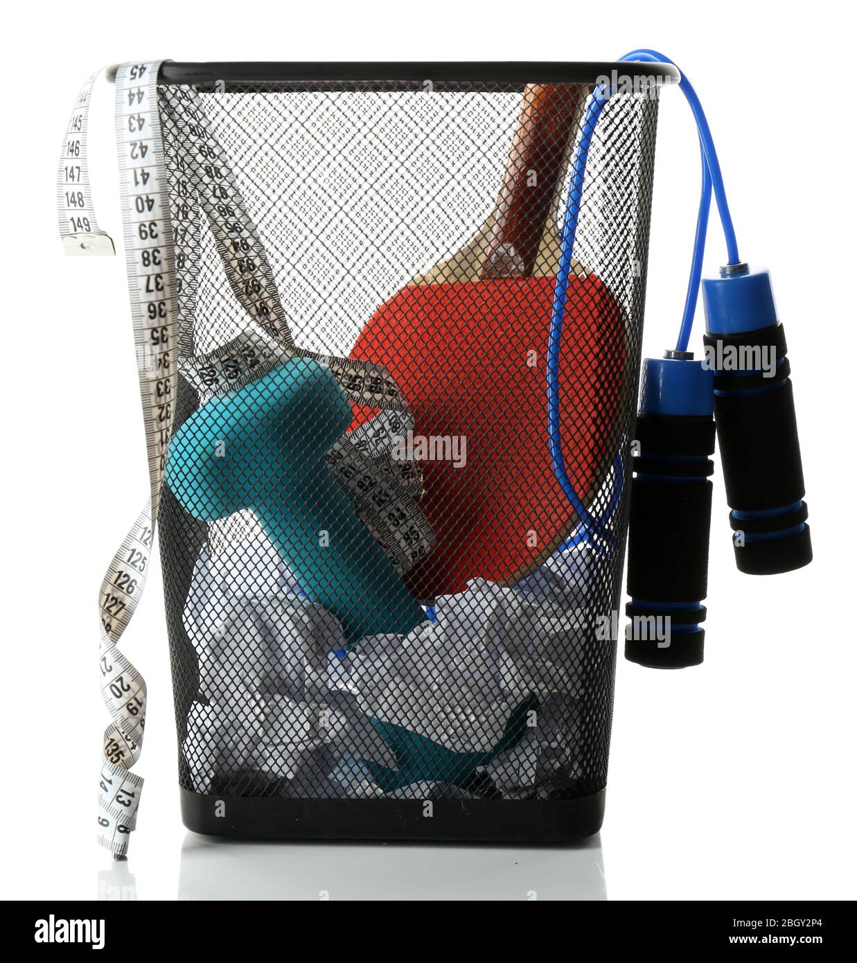 Metal trash bin with sport equipment, crumpled paper and weight scale ...