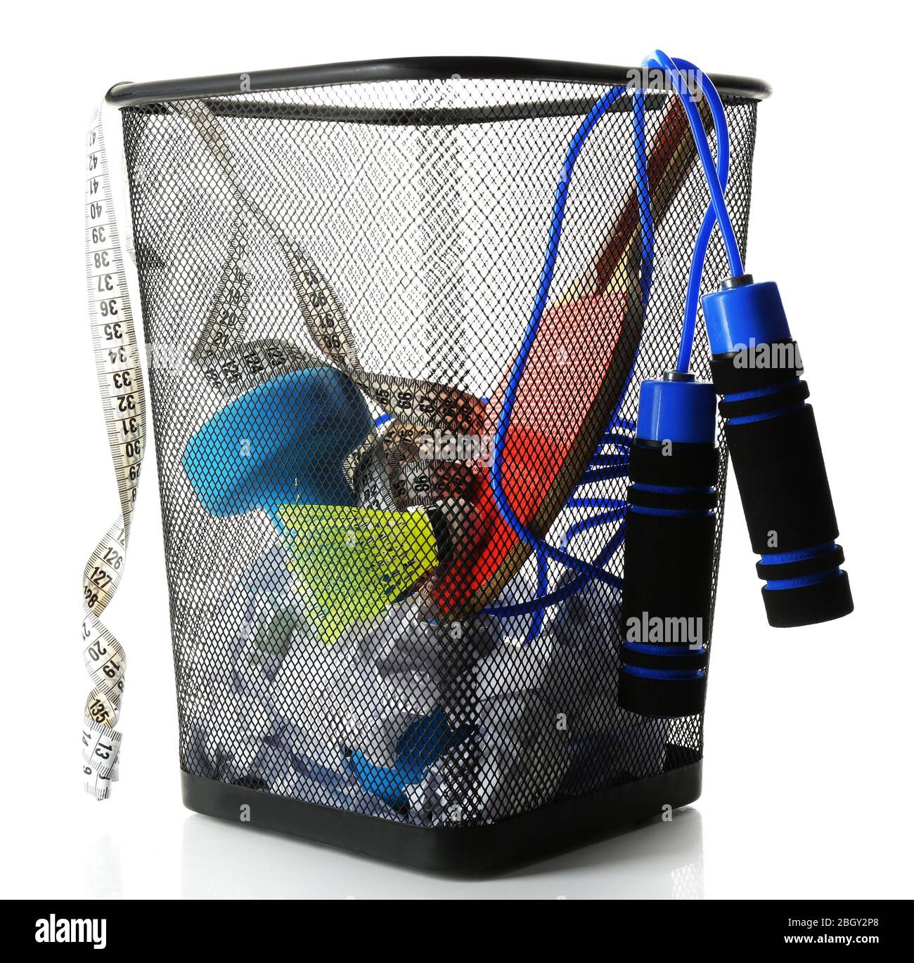 Metal trash bin with sport equipment, crumpled paper and weight scale ...