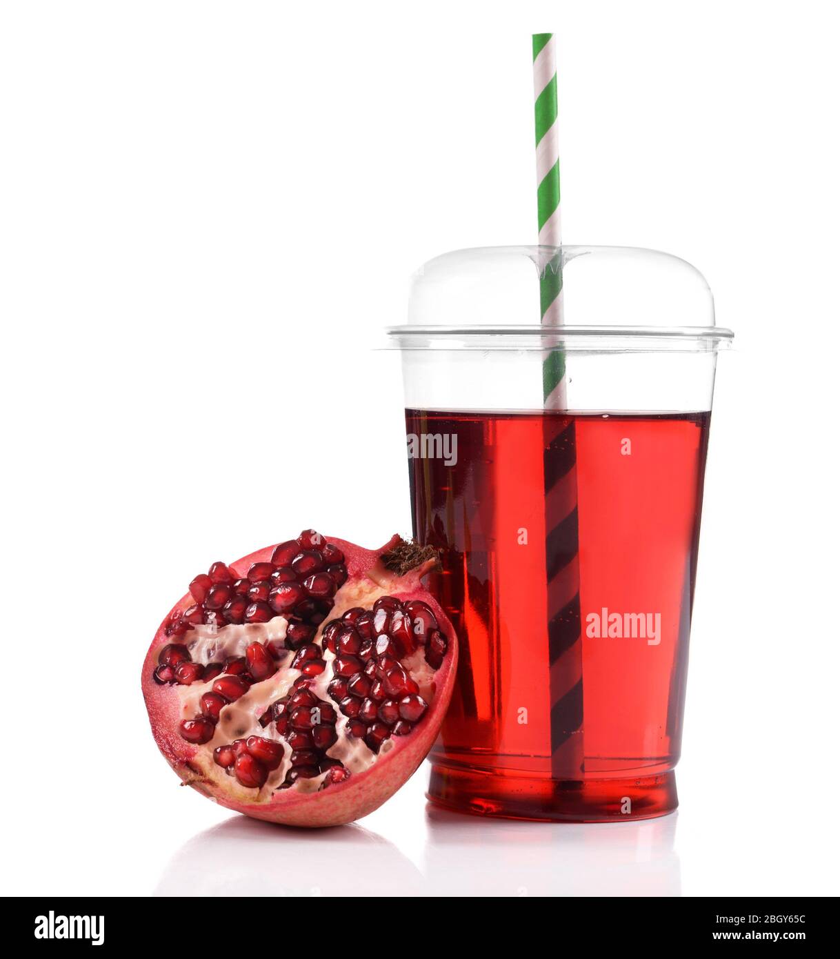 Pomegranate juice in fast food closed cup with tube and garnet isolated ...