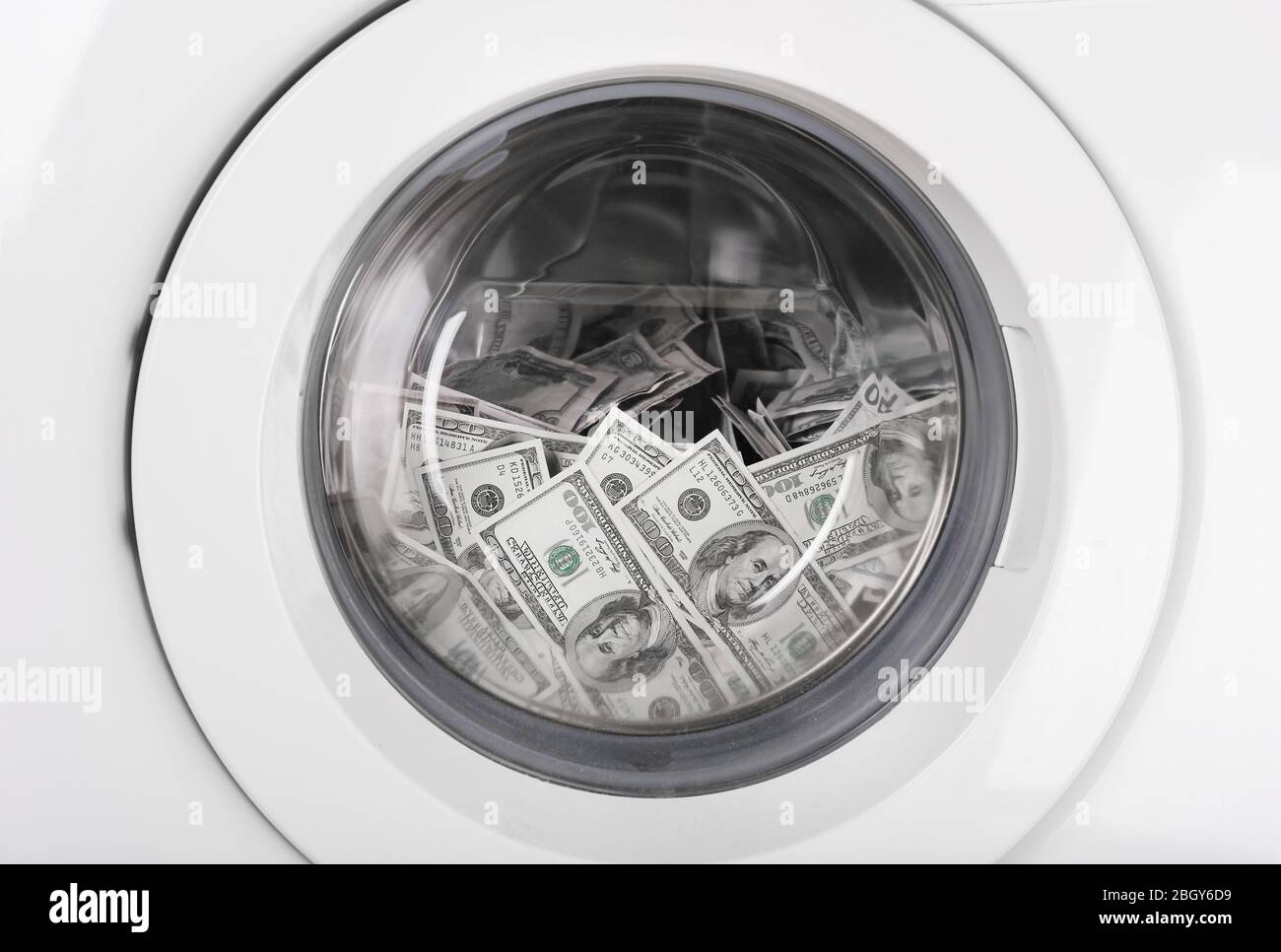 Money in washing machine, closeup view Stock Photo - Alamy