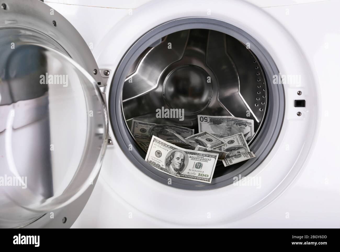 Money in washing machine, closeup view Stock Photo - Alamy