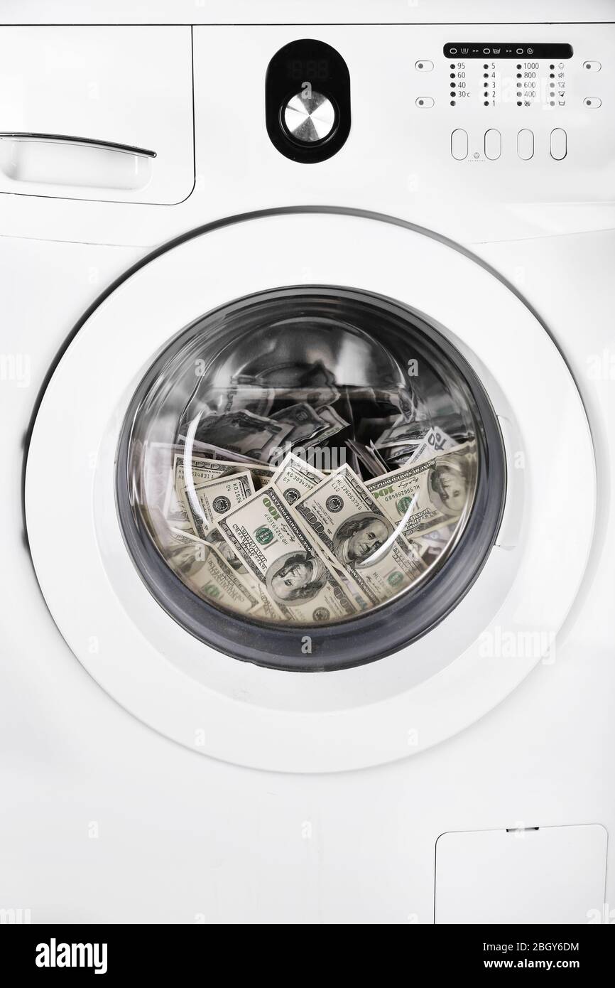 Money in washing machine, closeup view Stock Photo - Alamy