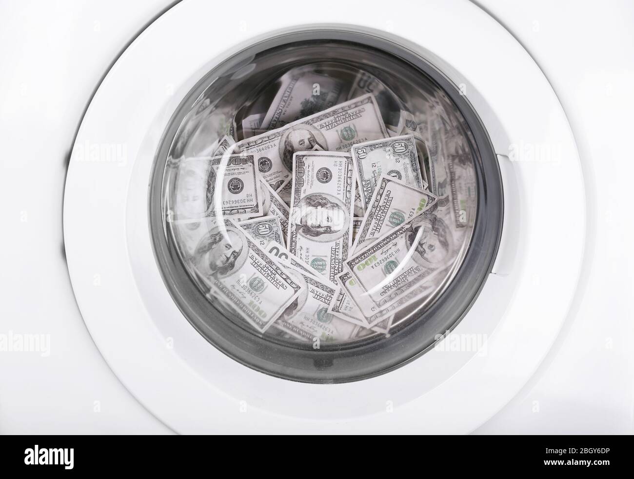Money in washing machine, closeup view Stock Photo - Alamy