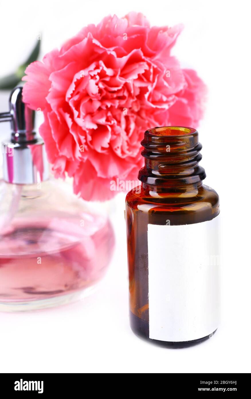 Bottle of perfume with clove on white background Stock Photo - Alamy