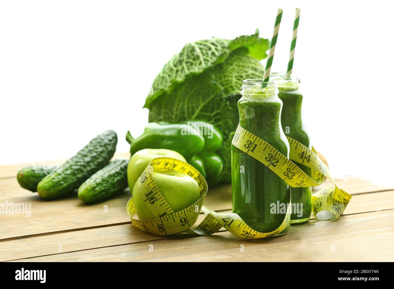 Green fresh healthy juice with fruits and vegetables isolated on white ...