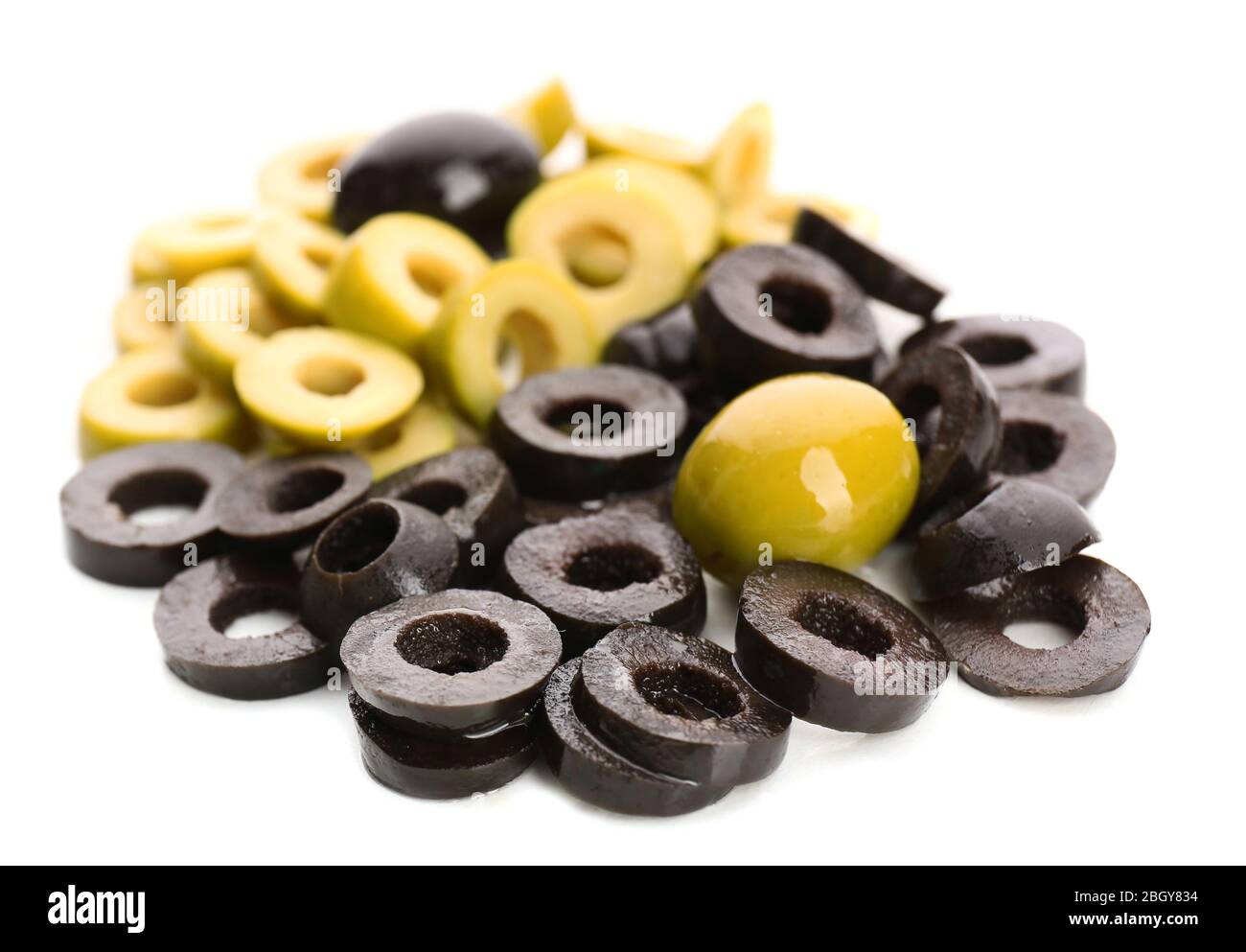 Cut olive rings isolated on white Stock Photo - Alamy