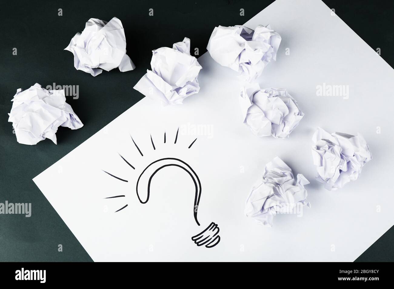 Question mark on sheet of paper on color table background Stock Photo ...