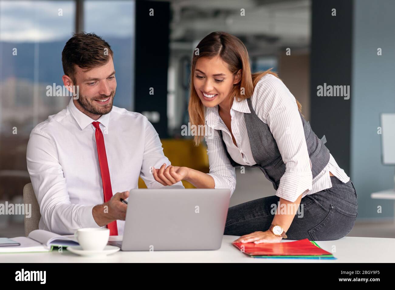 Young Business people working together on computer Stock Photo - Alamy