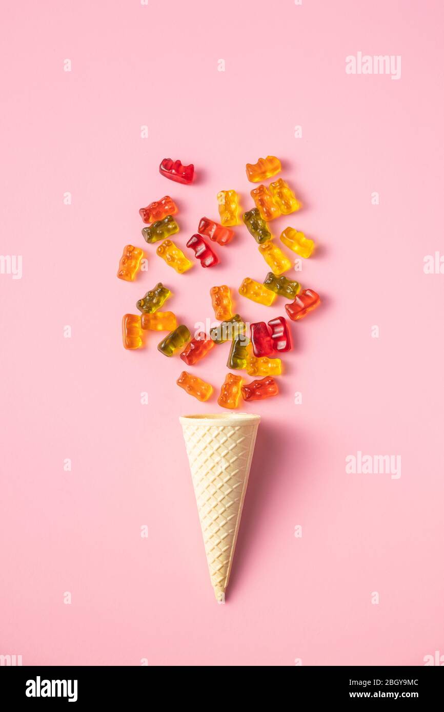 Gummy bears, jelly candy in ice cream wafel cone. Colorful bonbons on ...