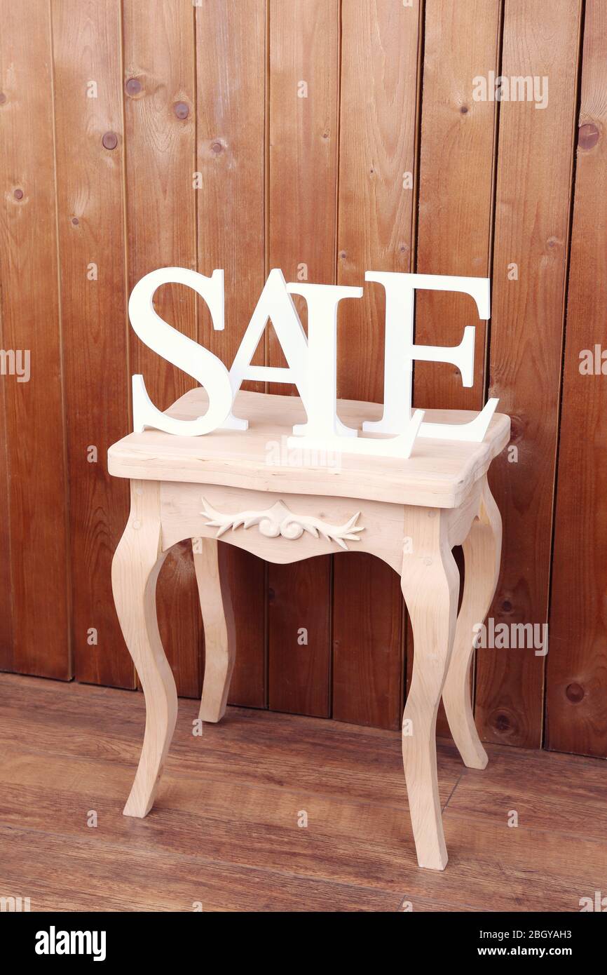 Sale on side table in room Stock Photo - Alamy