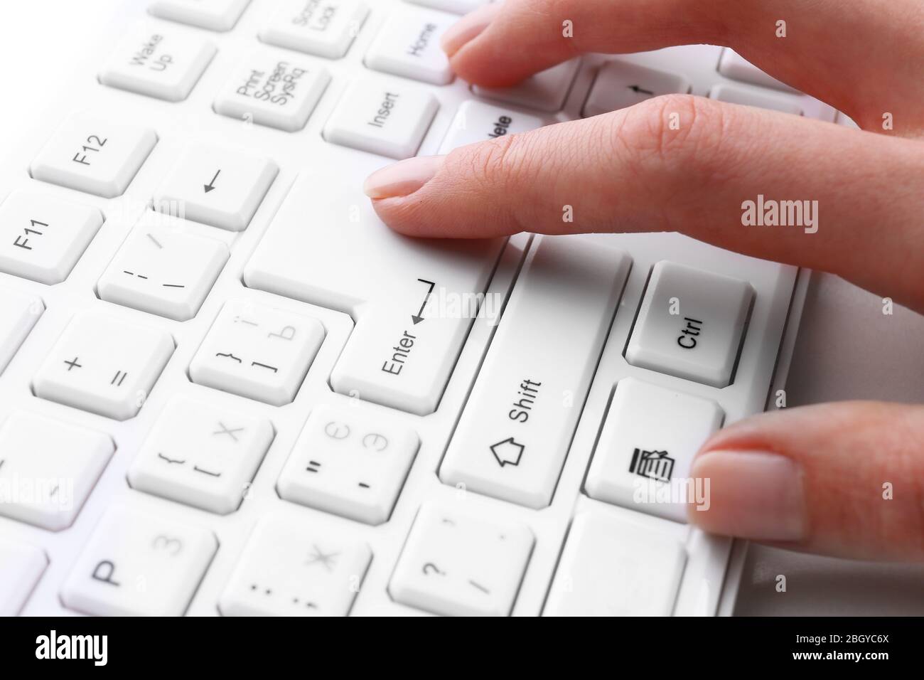 Female hand typing on keyboard, macro view Stock Photo - Alamy