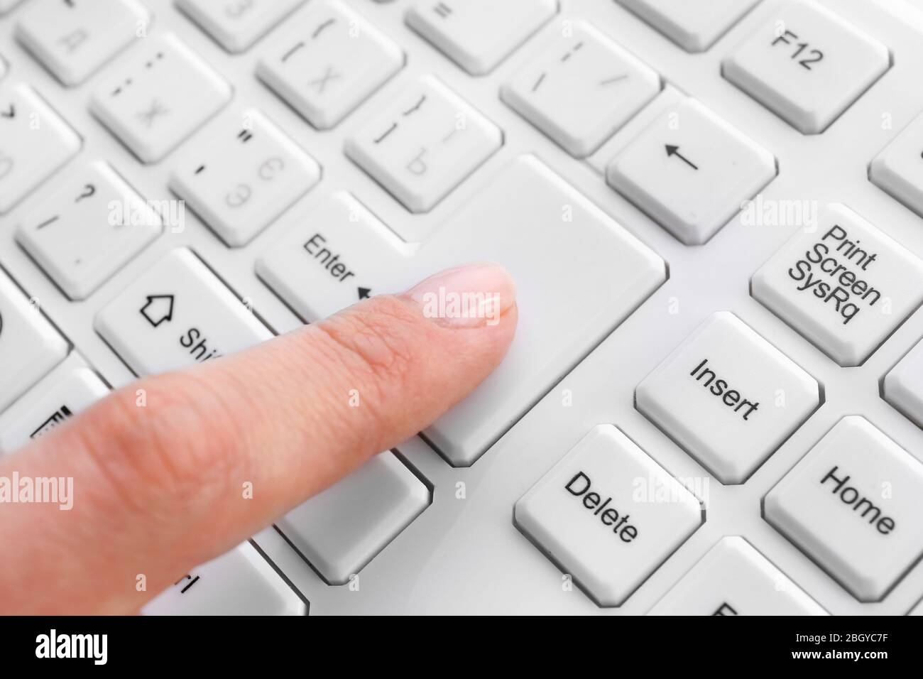 Female finger typing on keyboard, macro view Stock Photo - Alamy