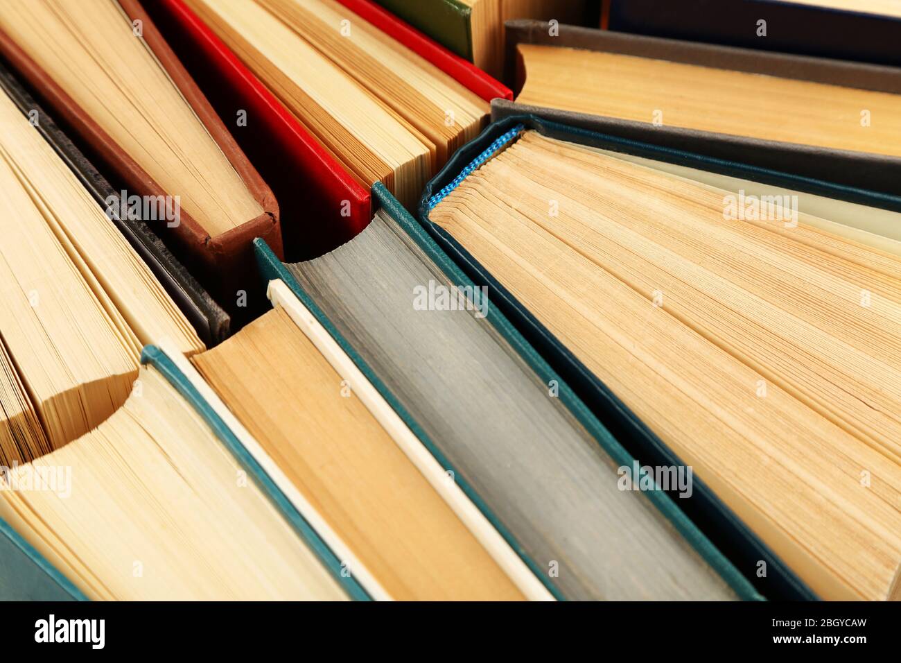 Pile of books, macro view Stock Photo - Alamy